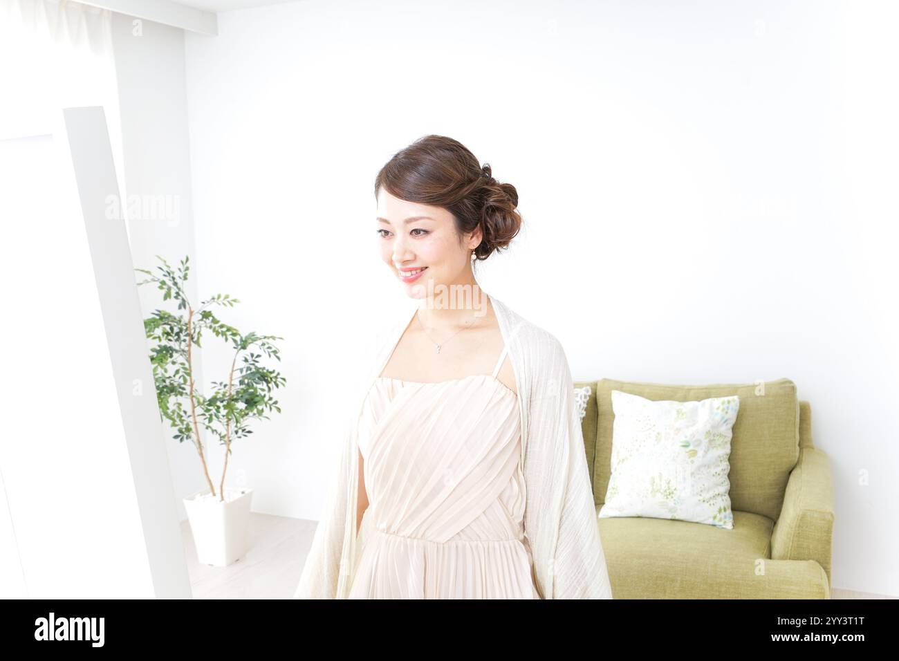 Woman getting ready to go out Stock Photo - Alamy