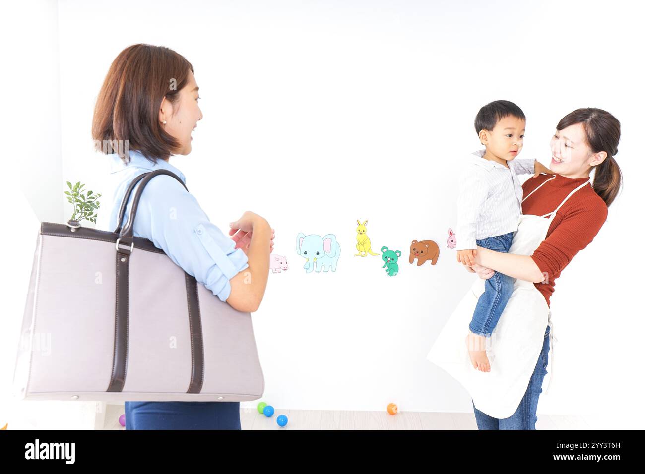 Mother picking up her child from kindergarten Stock Photo - Alamy