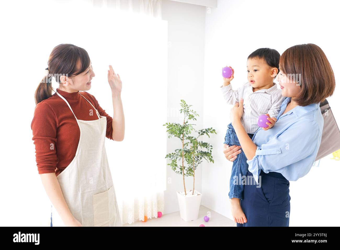 Mother picking up her child from kindergarten Stock Photo - Alamy