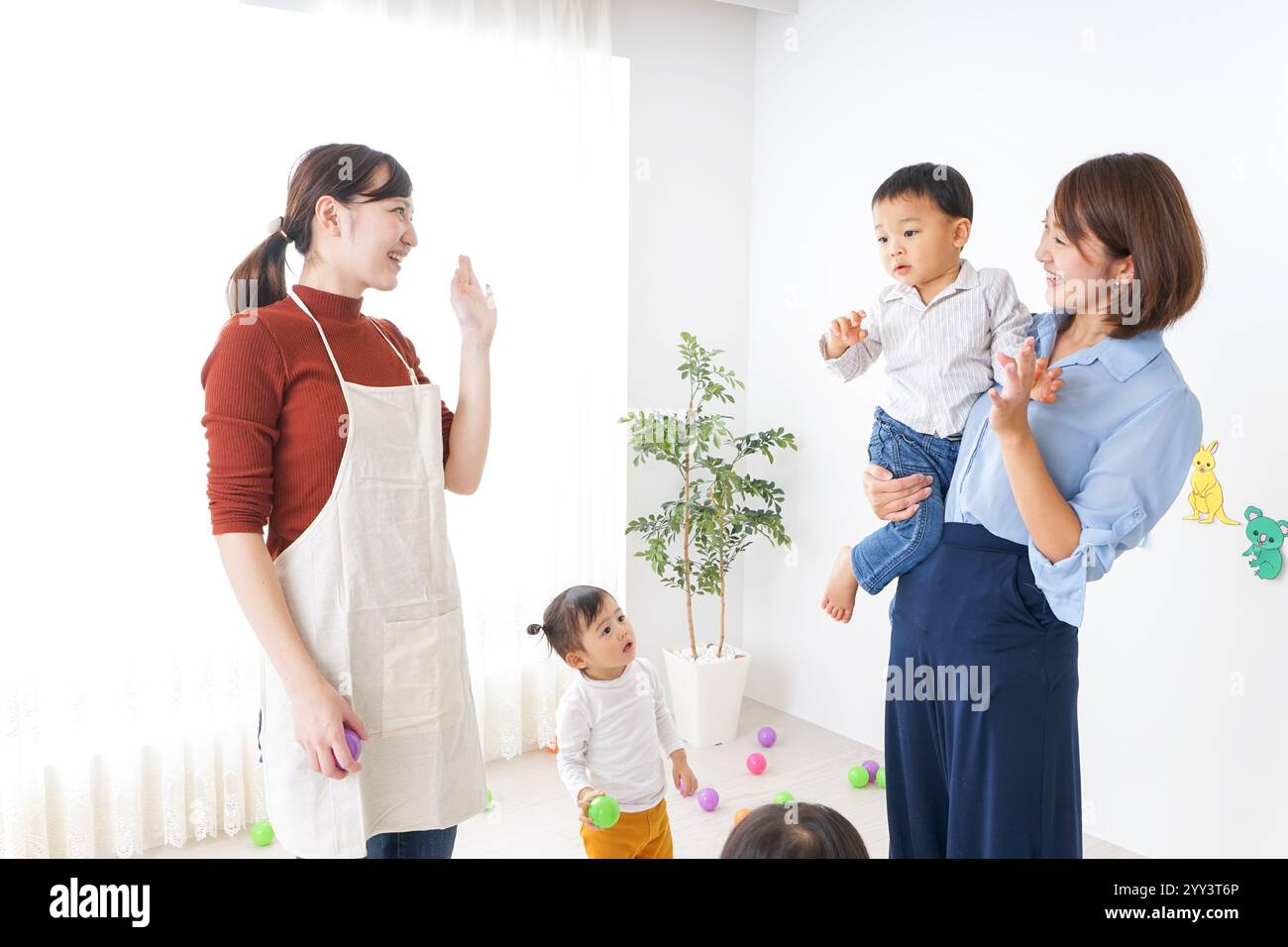 Mother picking up child from kindergarten Stock Photo - Alamy