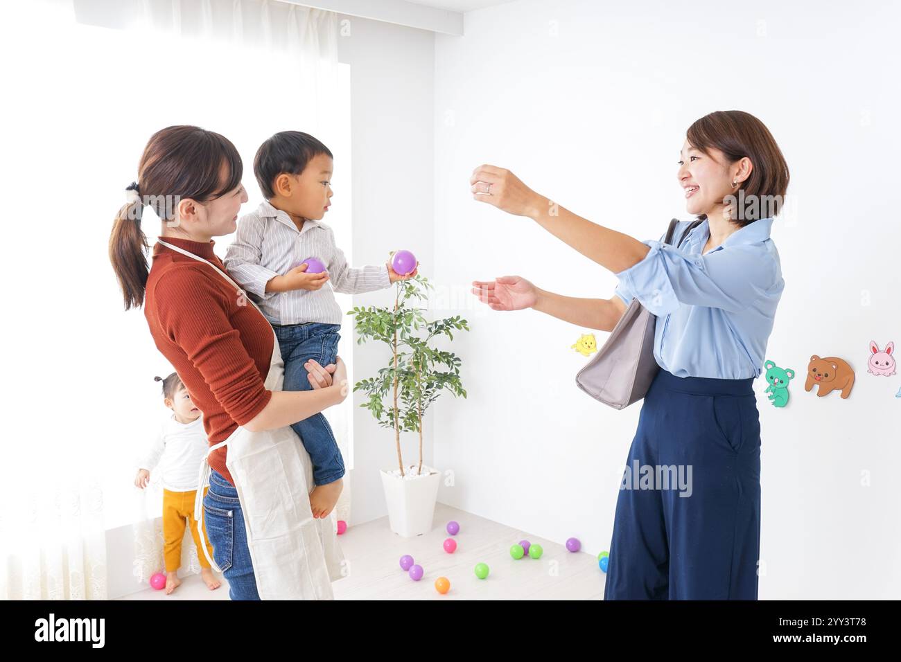 Mother picking up child from kindergarten Stock Photo - Alamy