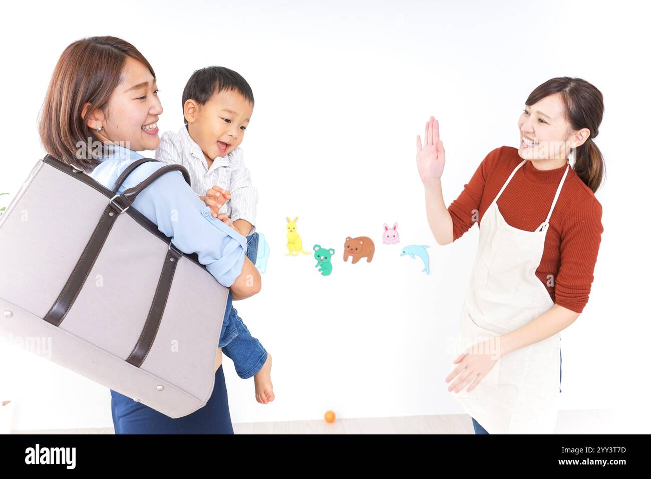 Mother picking up her child from kindergarten Stock Photo - Alamy