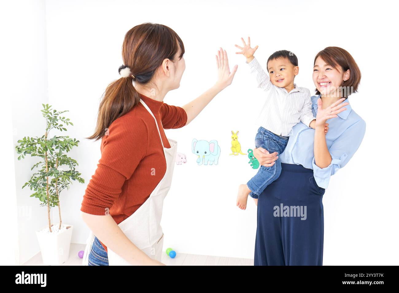 Mother picking up her child from kindergarten Stock Photo - Alamy