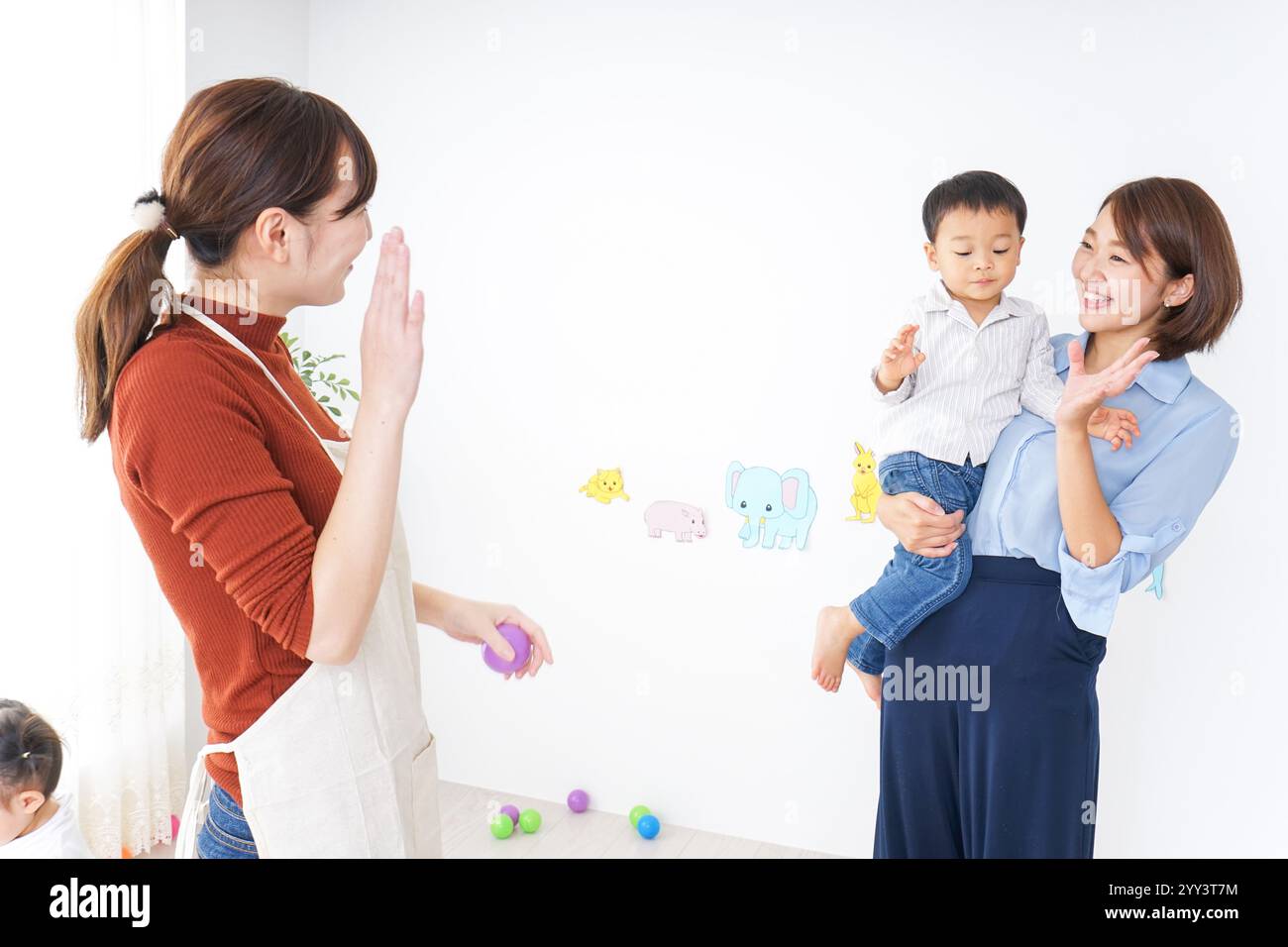 Mother picking up child from kindergarten Stock Photo - Alamy