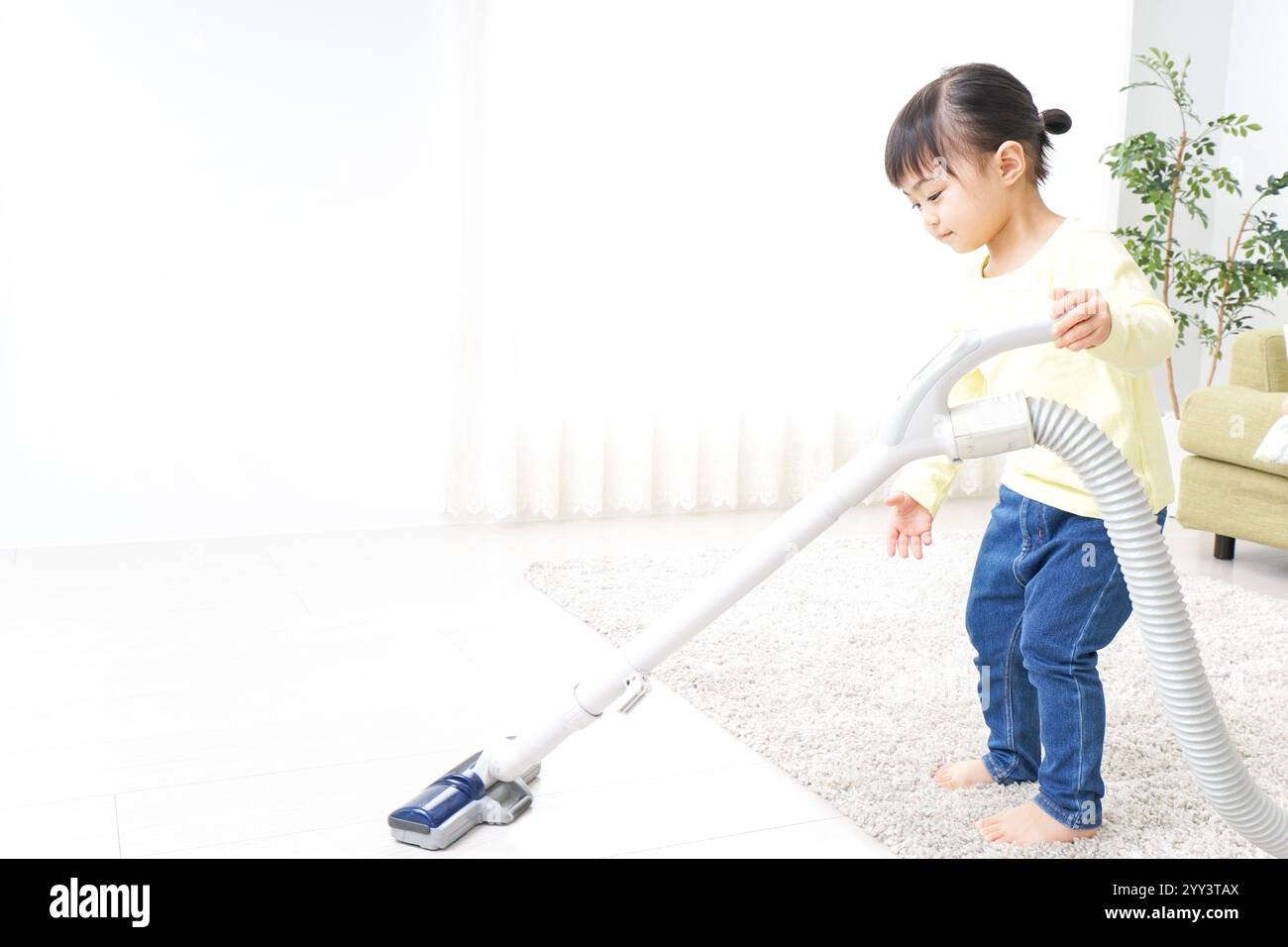 Child sweeping floor hi-res stock photography and images - Alamy