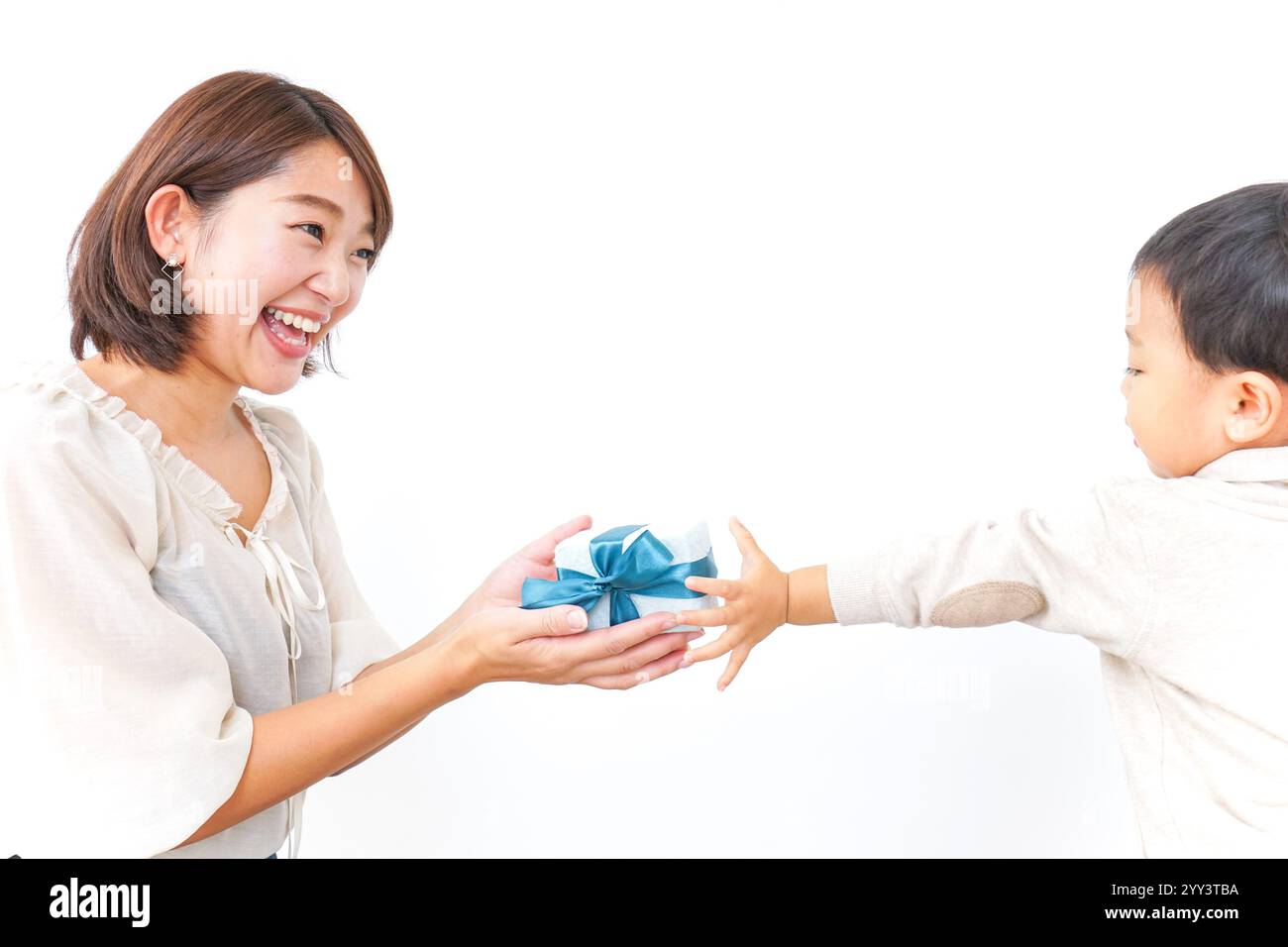 Child giving present to mother Stock Photo - Alamy