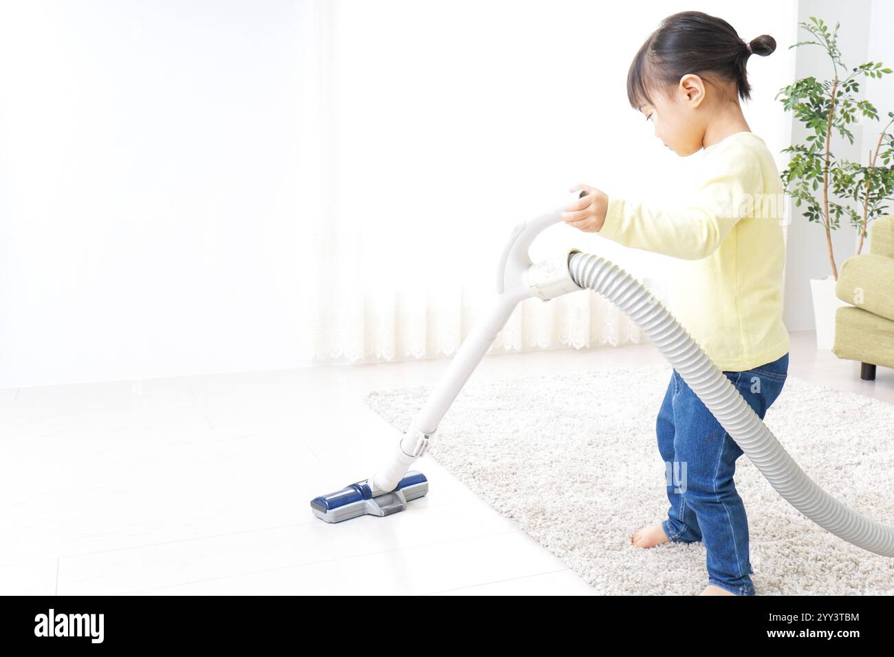 Child sweeping floor hi-res stock photography and images - Alamy