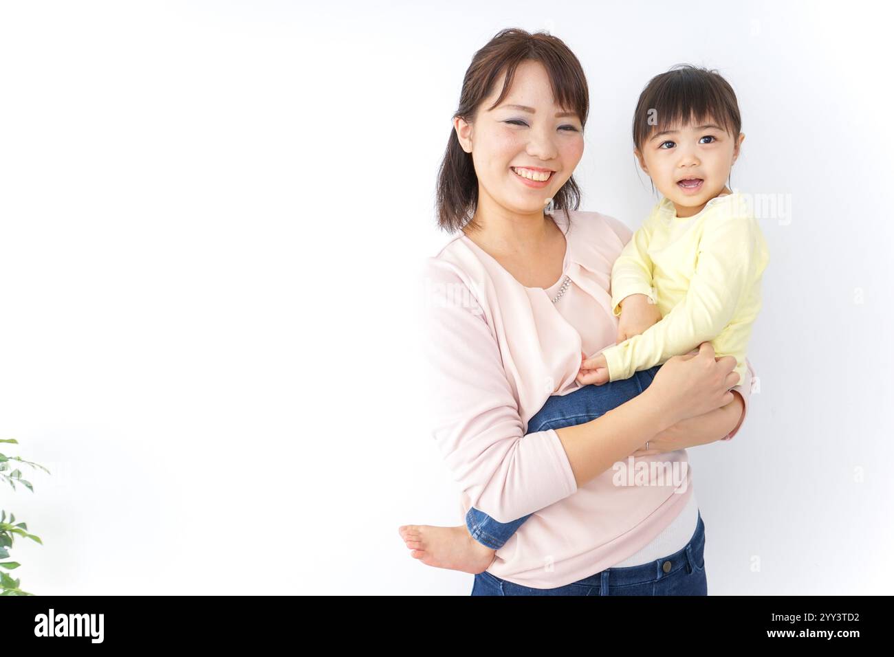 Mother carrying her child Stock Photo - Alamy