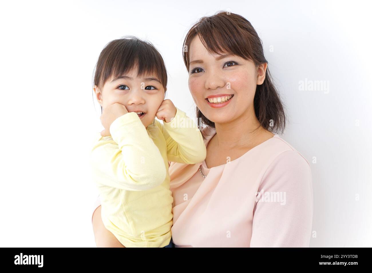 Mother carrying her child Stock Photo - Alamy