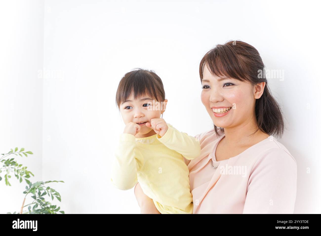 Mother carrying baby Stock Photo - Alamy