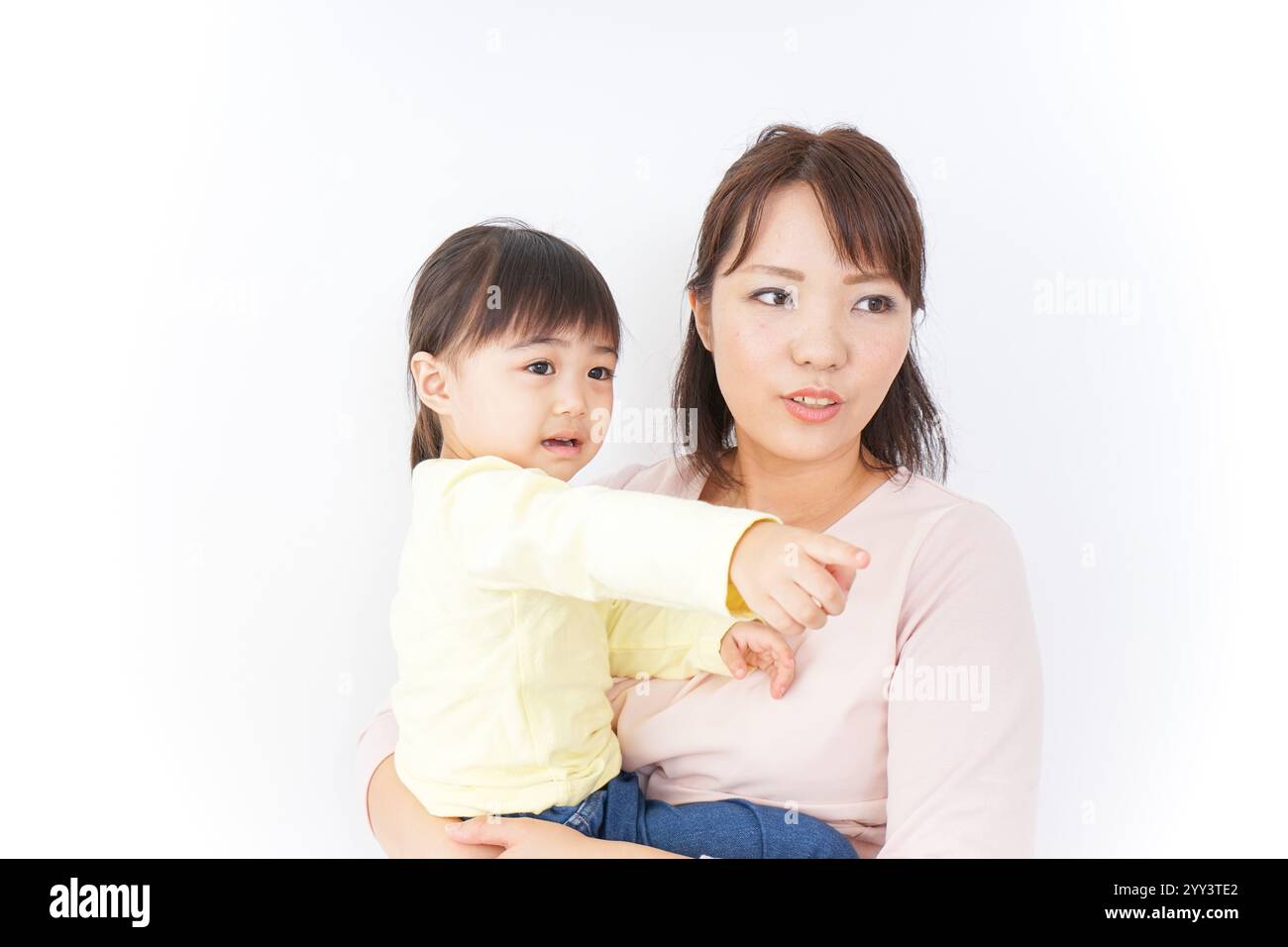 Mother carrying baby Stock Photo - Alamy