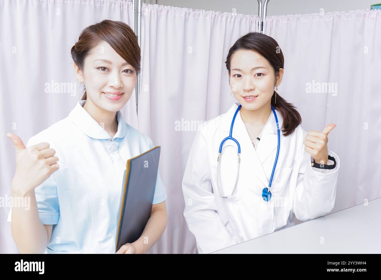 Female medical doctor giving thumbs hi-res stock photography and images - Alamy