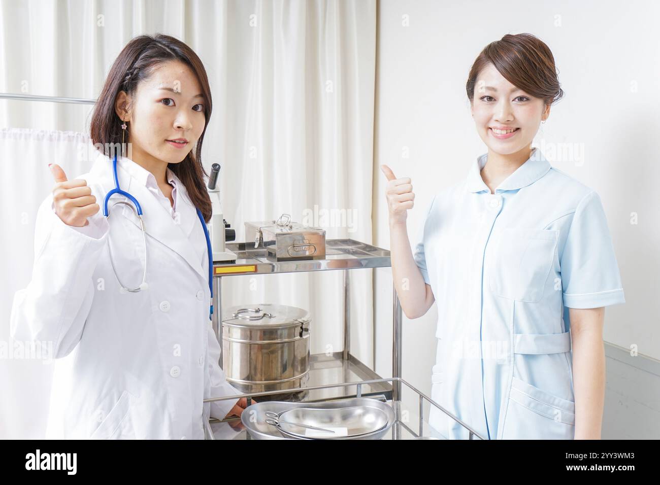 Doctor and nurse giving the Good sign Stock Photo - Alamy