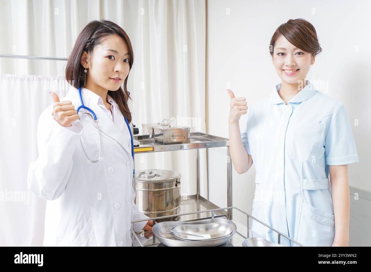 Doctor and nurse giving the Good sign Stock Photo - Alamy
