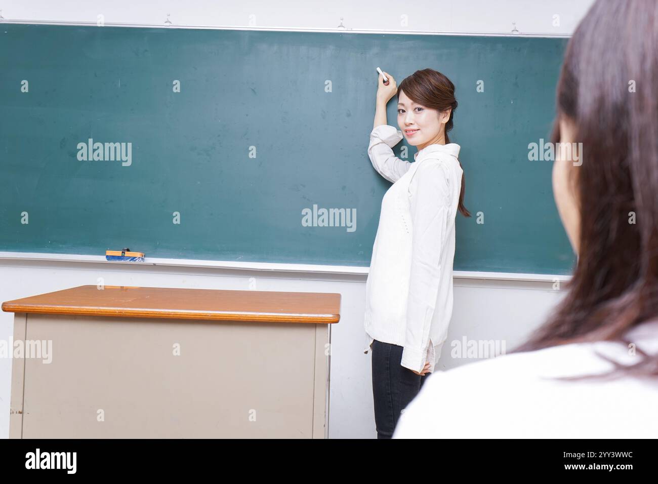 Teacher giving a lesson at school Stock Photo - Alamy