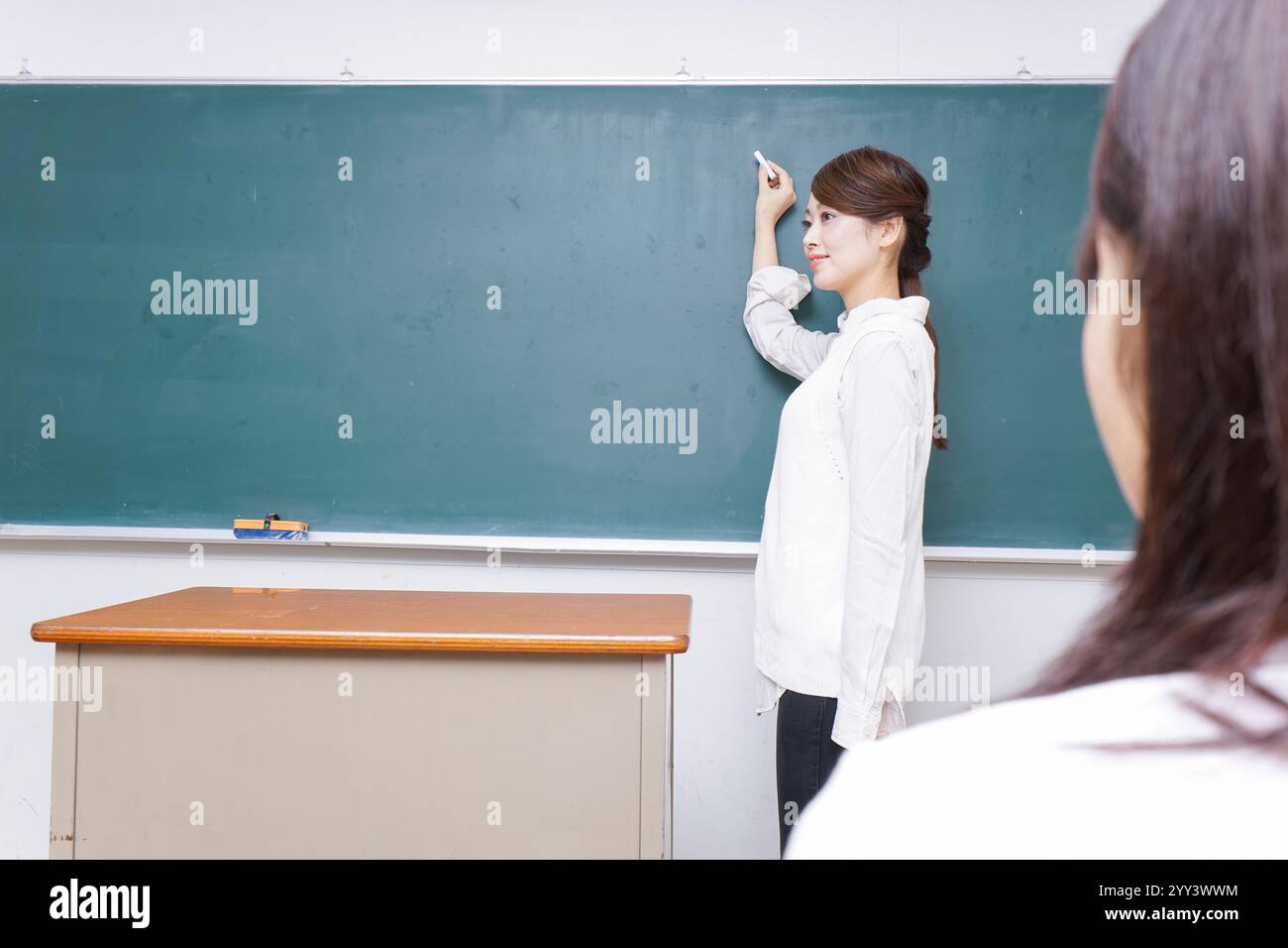 Teacher giving a lesson at school Stock Photo - Alamy