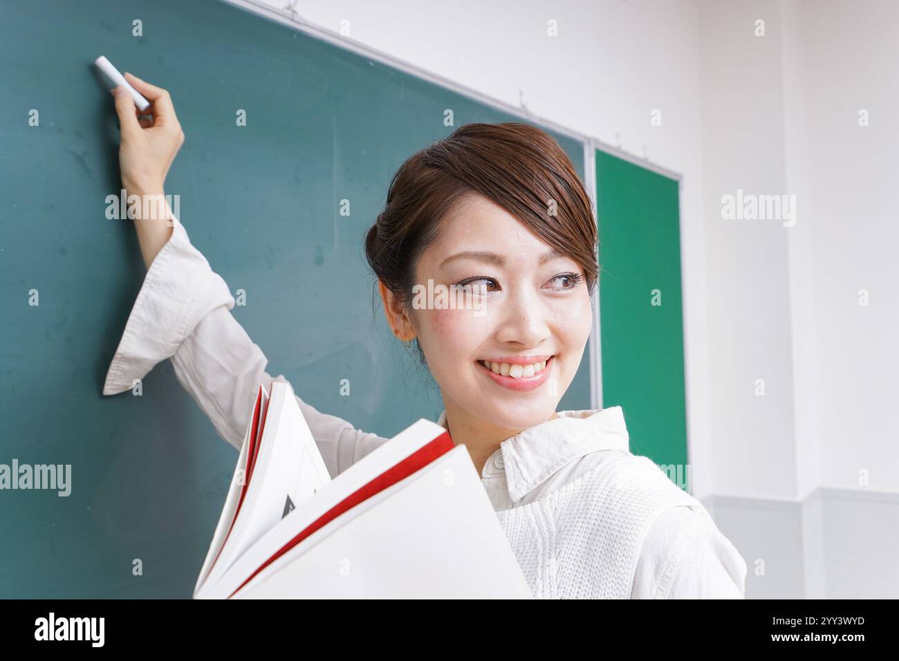 Female teacher giving a class Stock Photo - Alamy