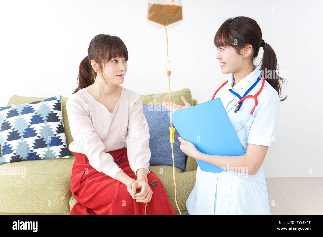 Patients receiving treatment at home and visiting nurses Stock Photo ...
