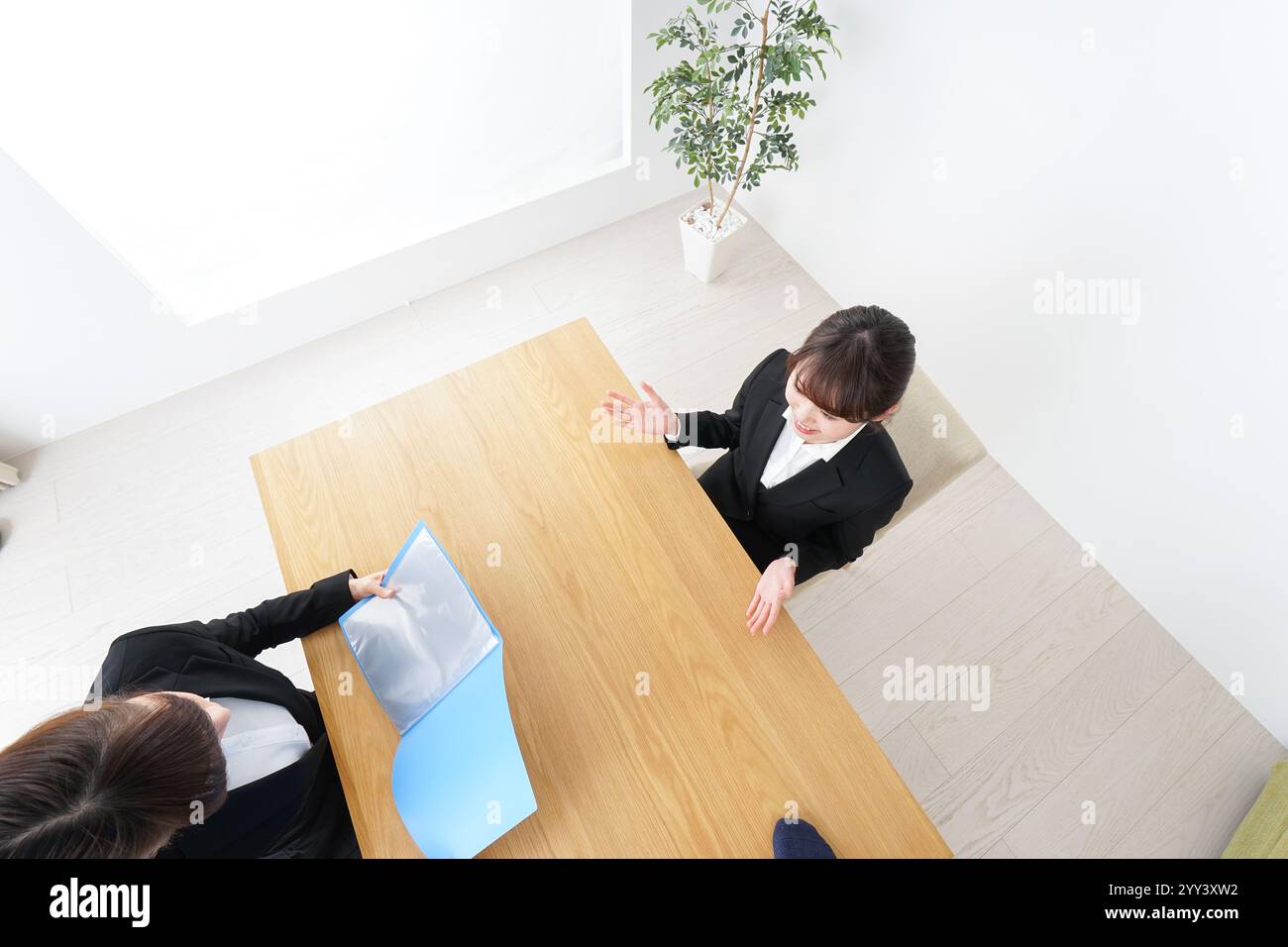 Woman in suit being interviewed Stock Photo - Alamy
