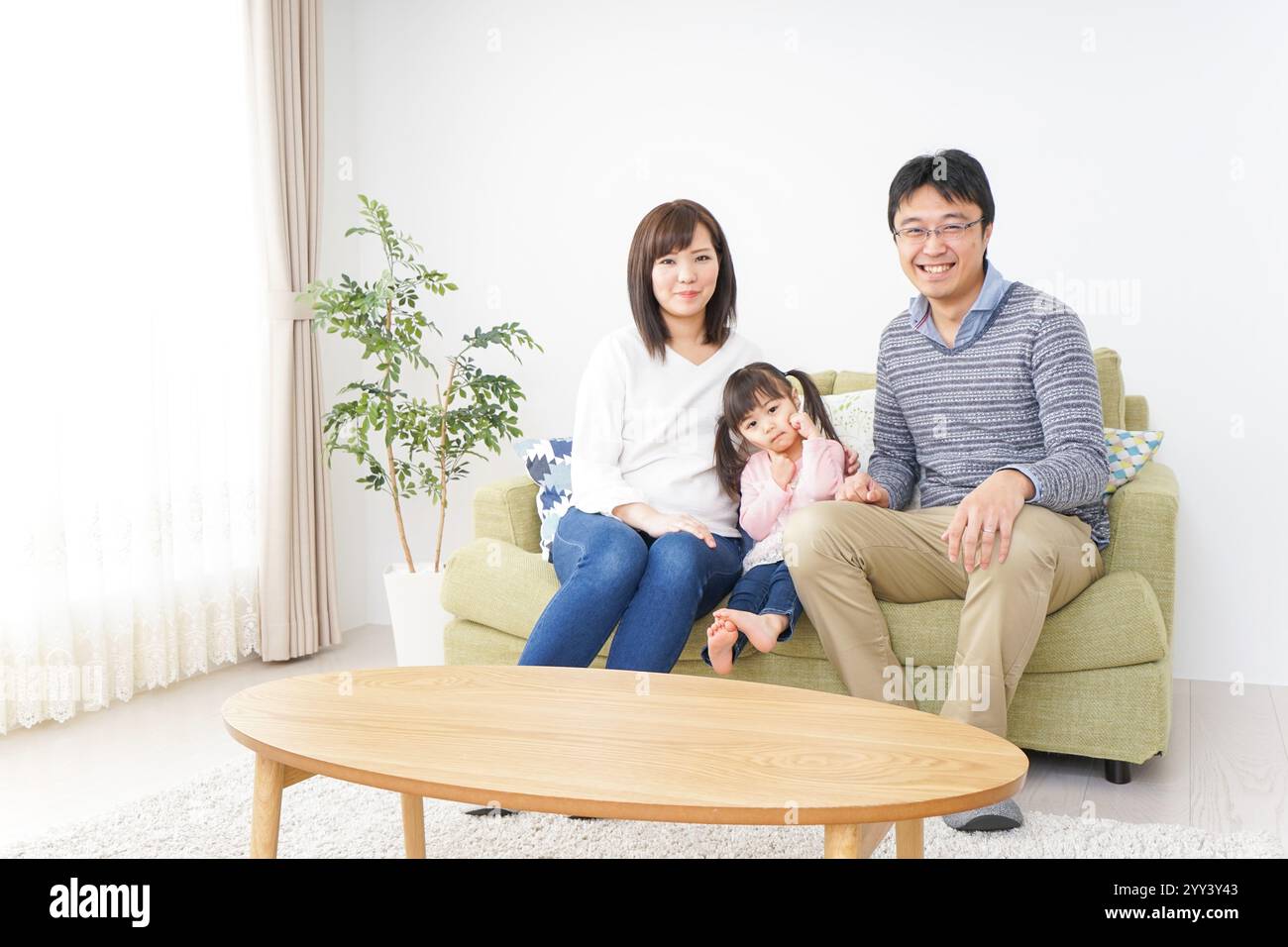 Happy family at home with family Stock Photo - Alamy