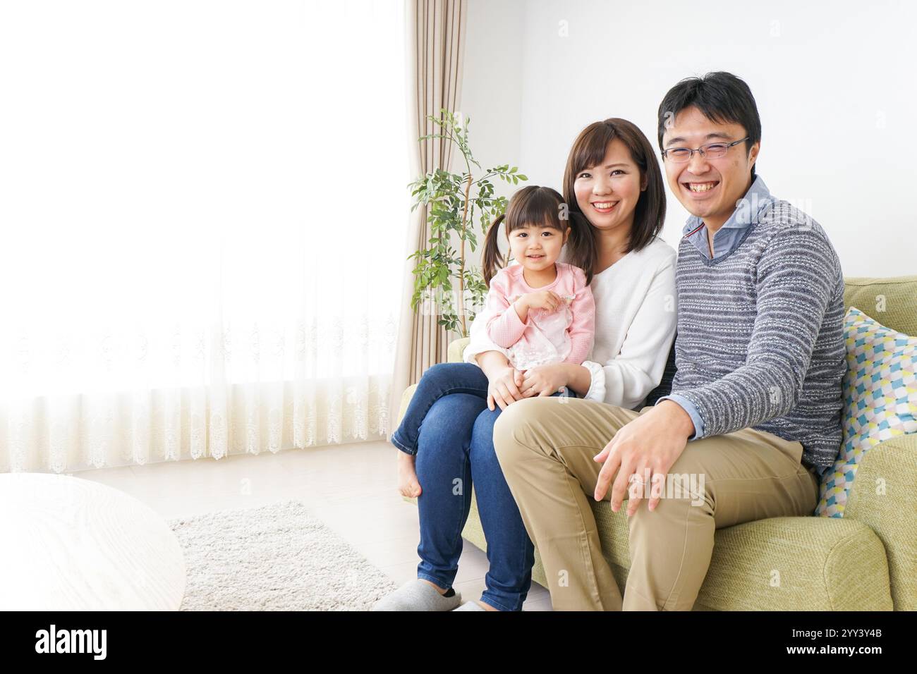 Happy family at home with family Stock Photo - Alamy