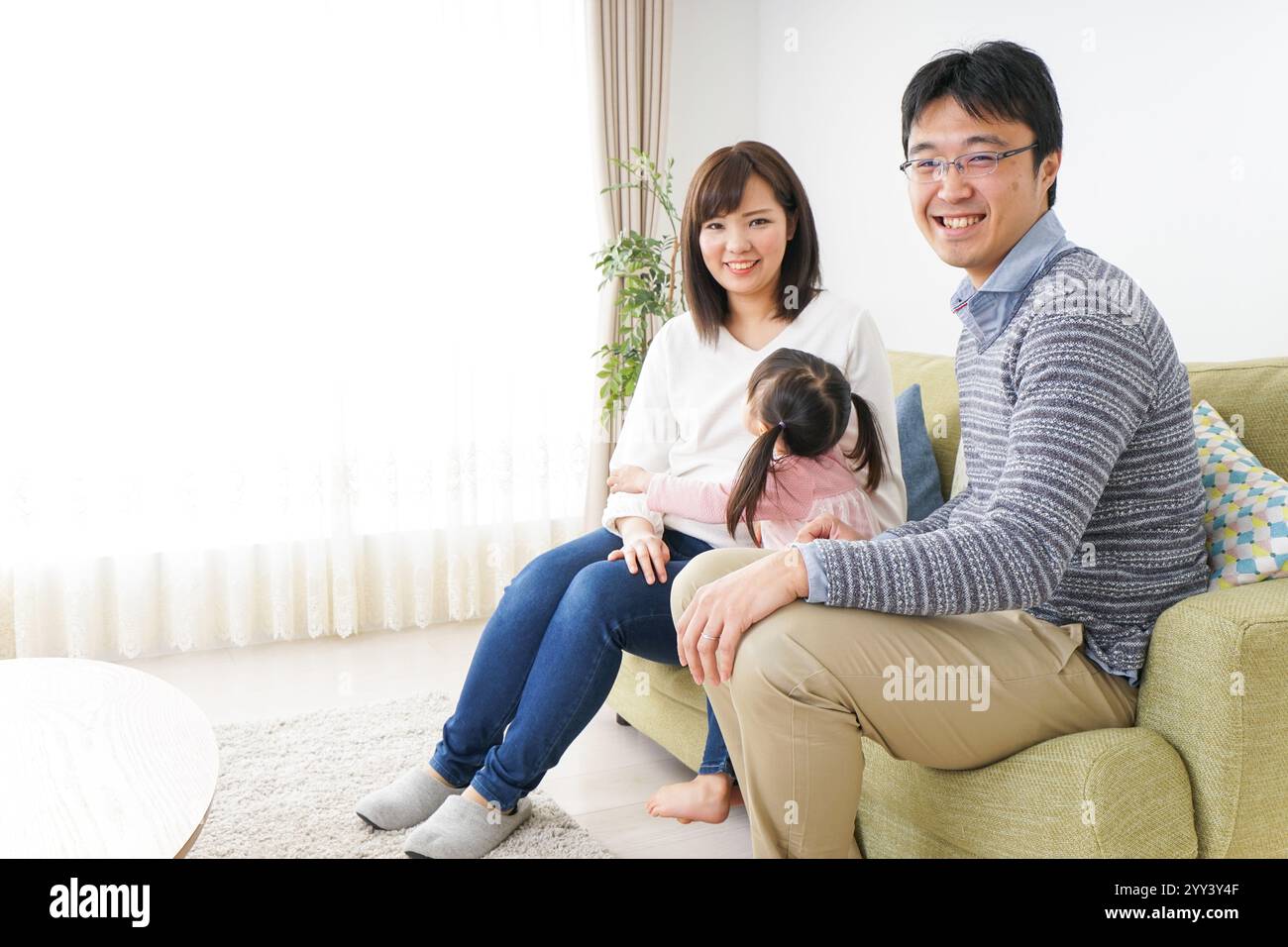 Happy family at home with family Stock Photo - Alamy