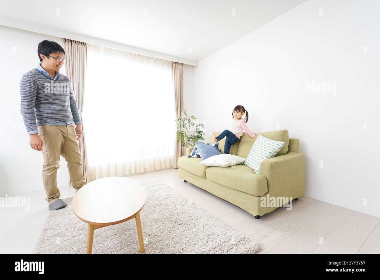 Fathers raising children Stock Photo - Alamy