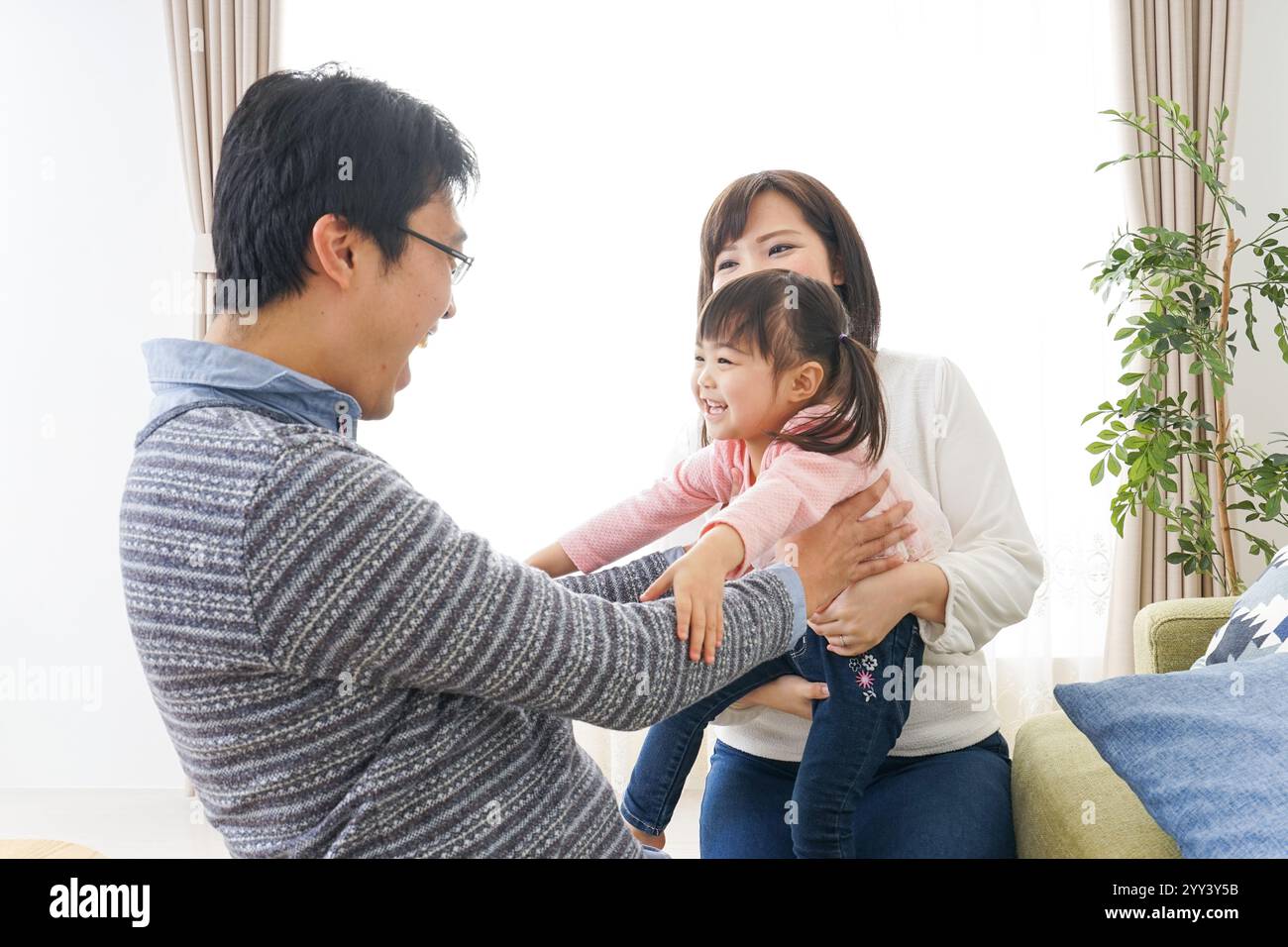 Happy family with home hi-res stock photography and images - Alamy