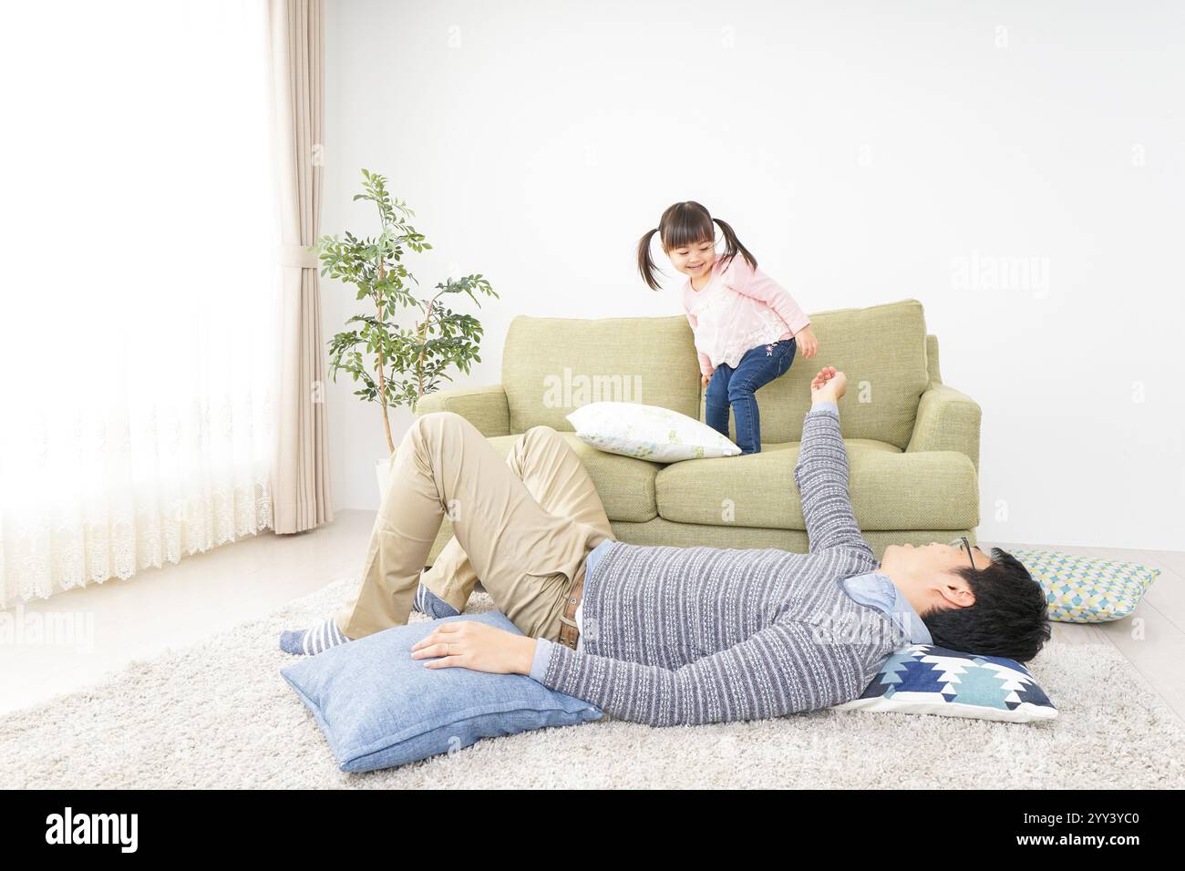 Fathers raising children Stock Photo - Alamy