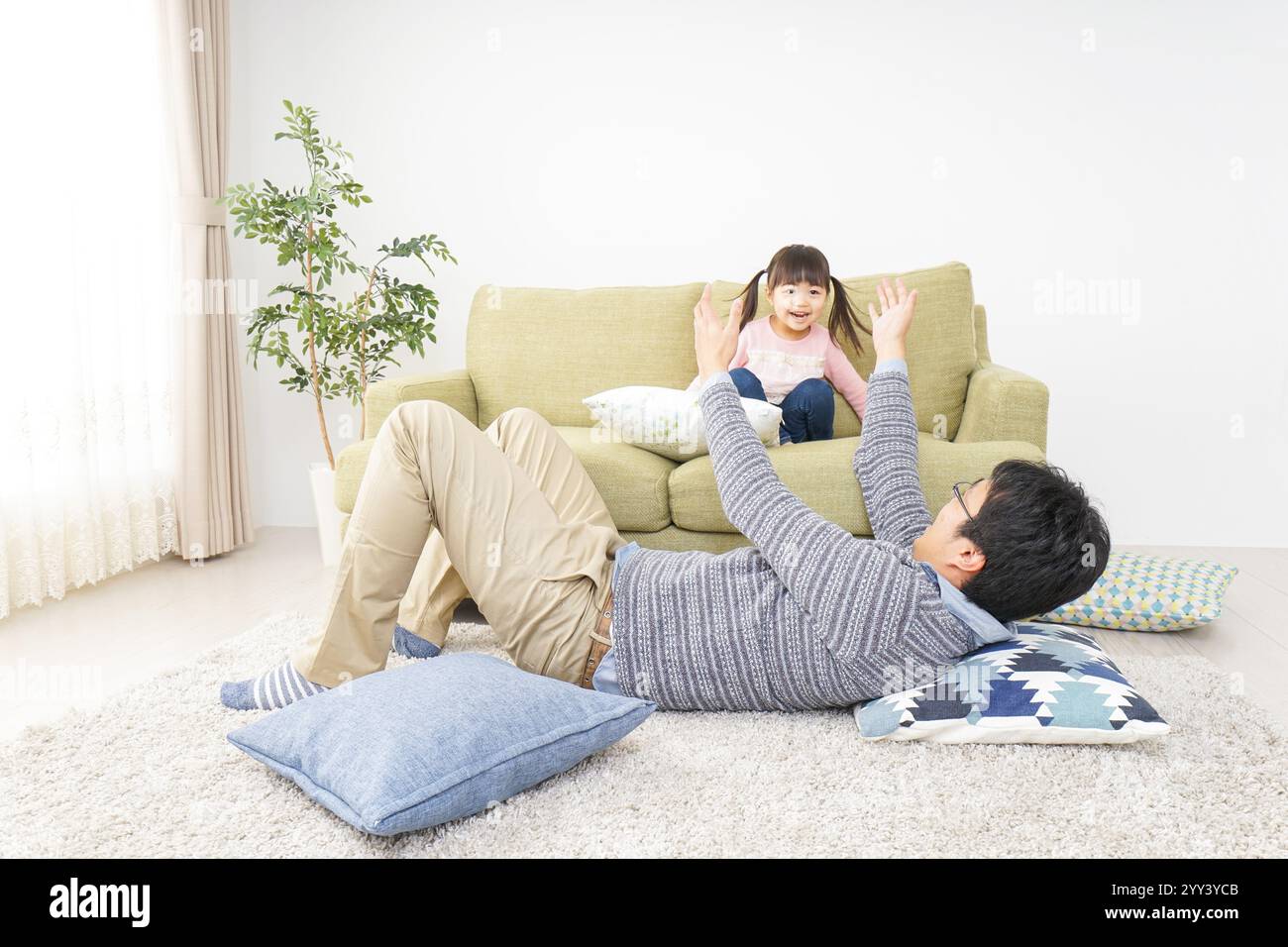 Fathers raising children Stock Photo - Alamy