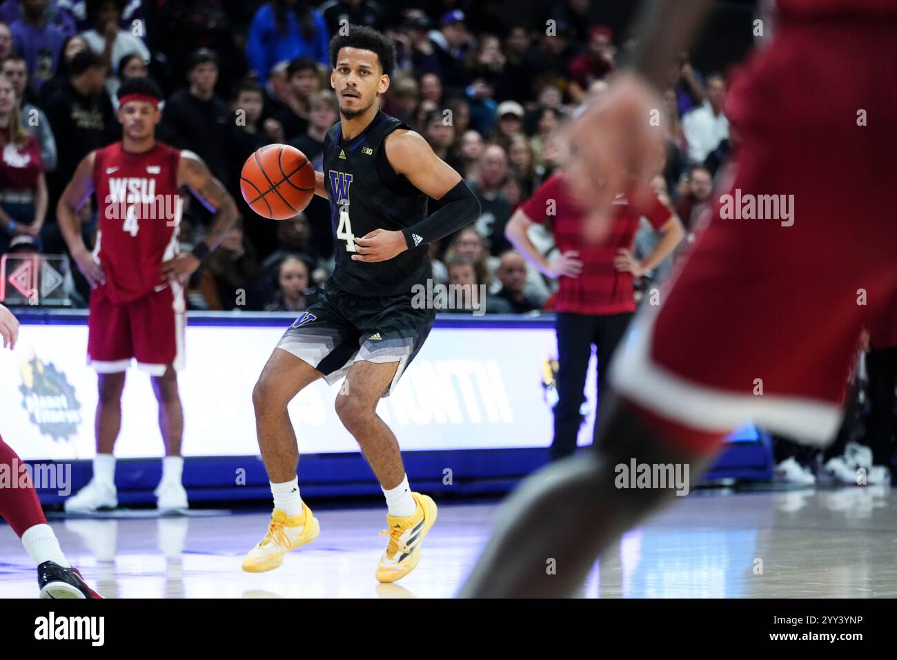 Washington guard DJ Davis moves the ball against Washington State ...