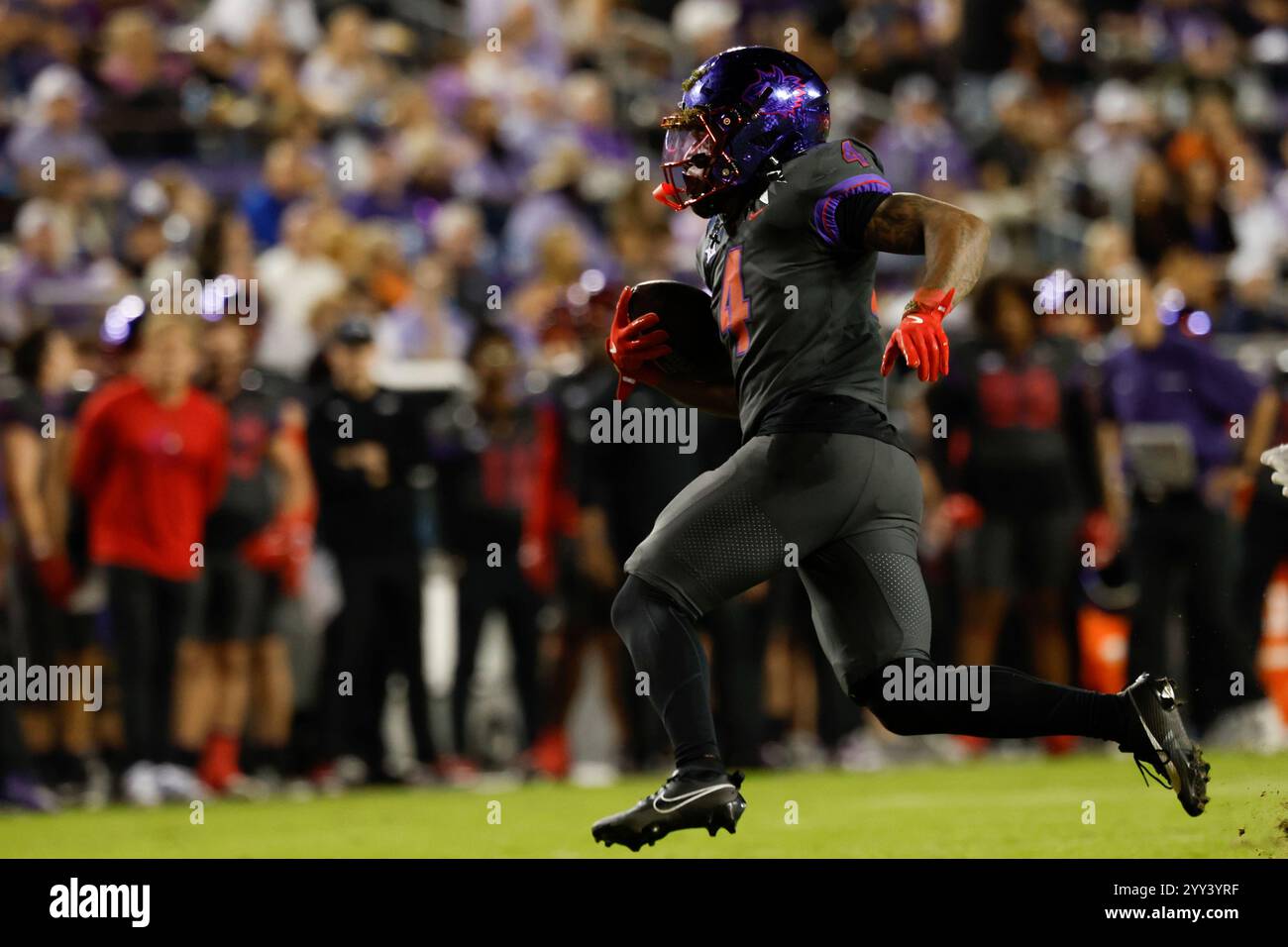 TCU running back Cam Cook (4) carries the ball during an NCAA college ...
