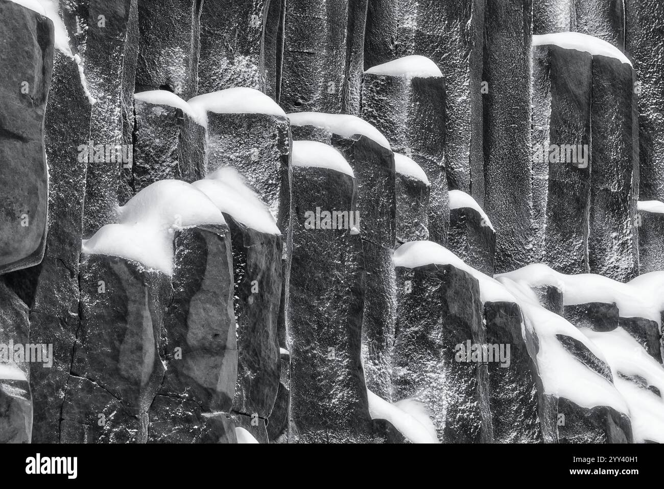 Snow capped basalt columns in a sea cliff, Iceland Stock Photo - Alamy