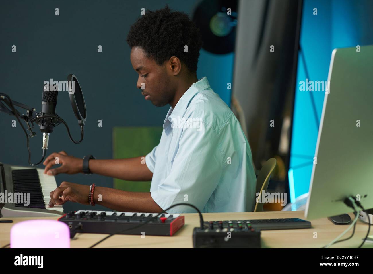 African american playing keyboard recording hi-res stock photography ...