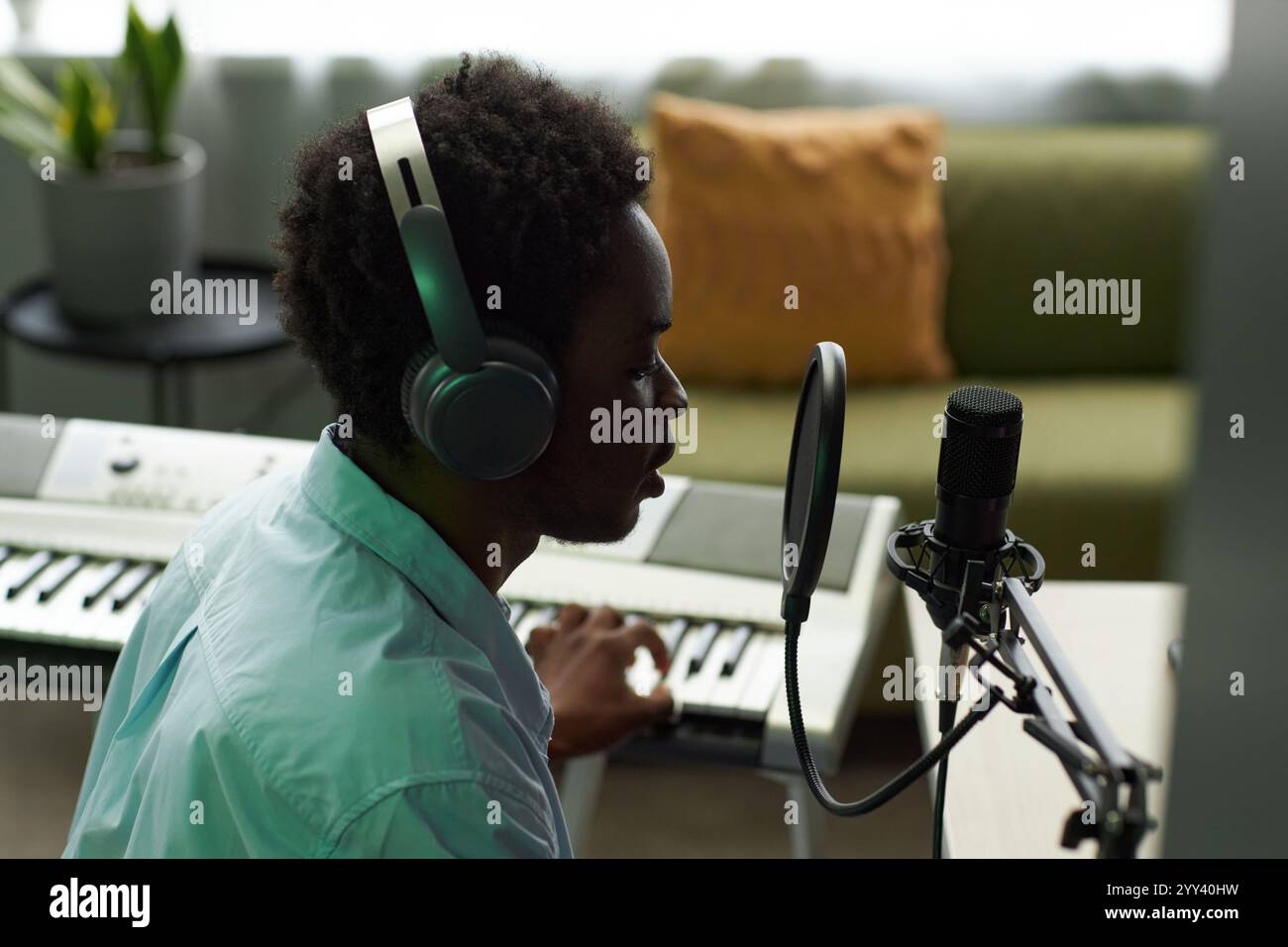 Singer Singing In Microphone And Recording Song Stock Photo - Alamy