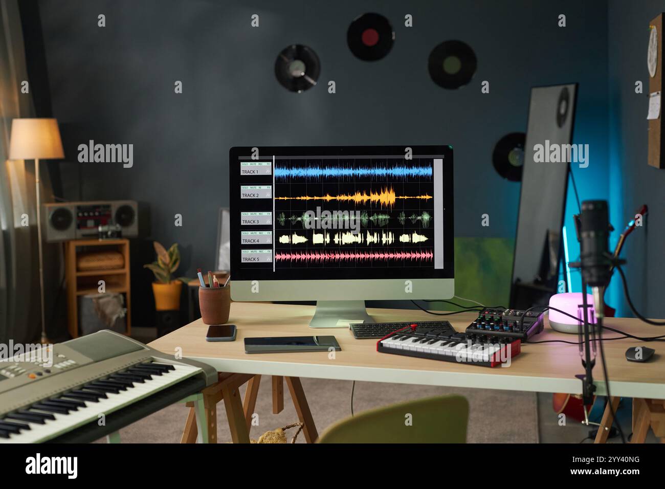 Workplace of producer with microphone and computer for recording music ...