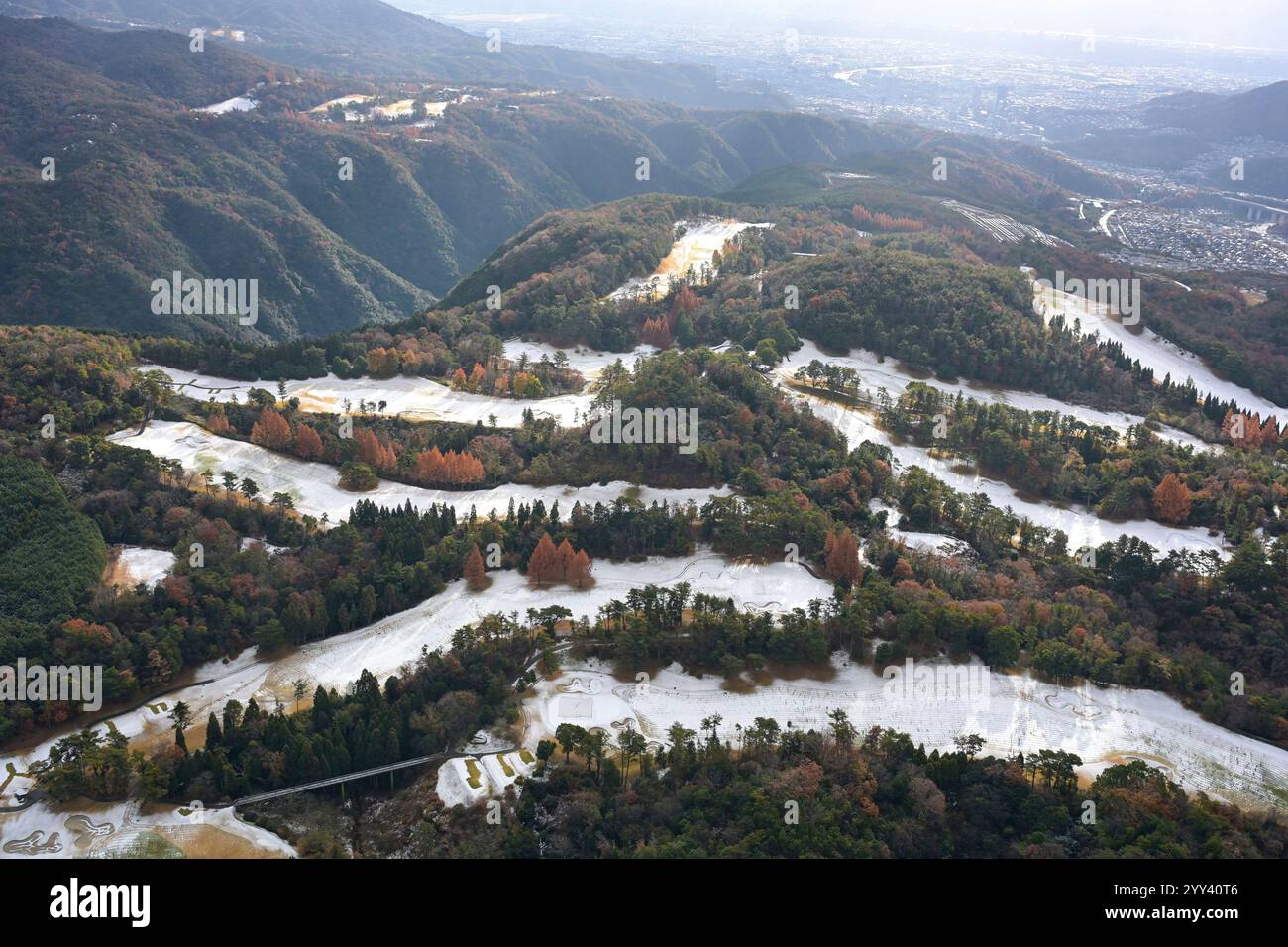 An aerial photo shows a golf course "Yomiuri Country Club" covered in snow in Nishinomiya City ...