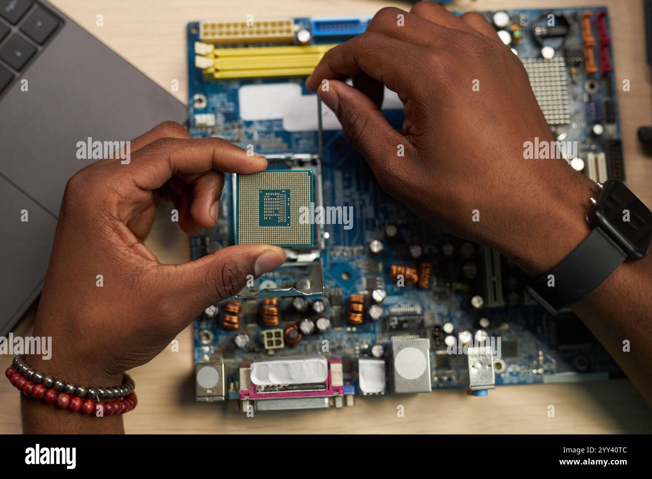 Repairman Setting Chip In Motherboard Stock Photo - Alamy