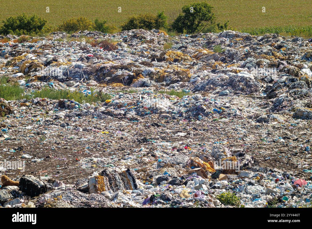 A view of a city dump or landfill. A pile of plastic garbage, food ...