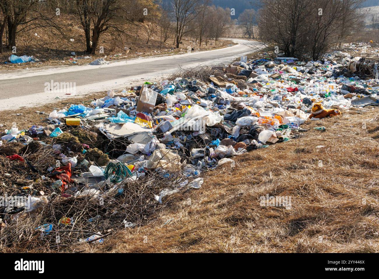 A dump of garbage left on the side of the road to understand the ...