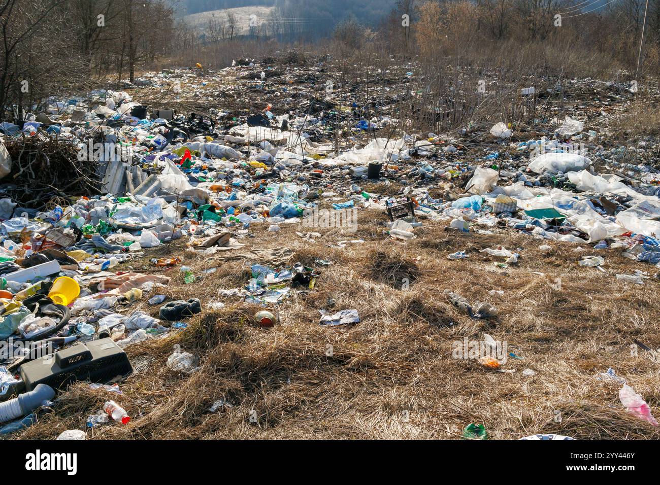 A natural dumping ground for garbage, used plastic bottles, bags and ...