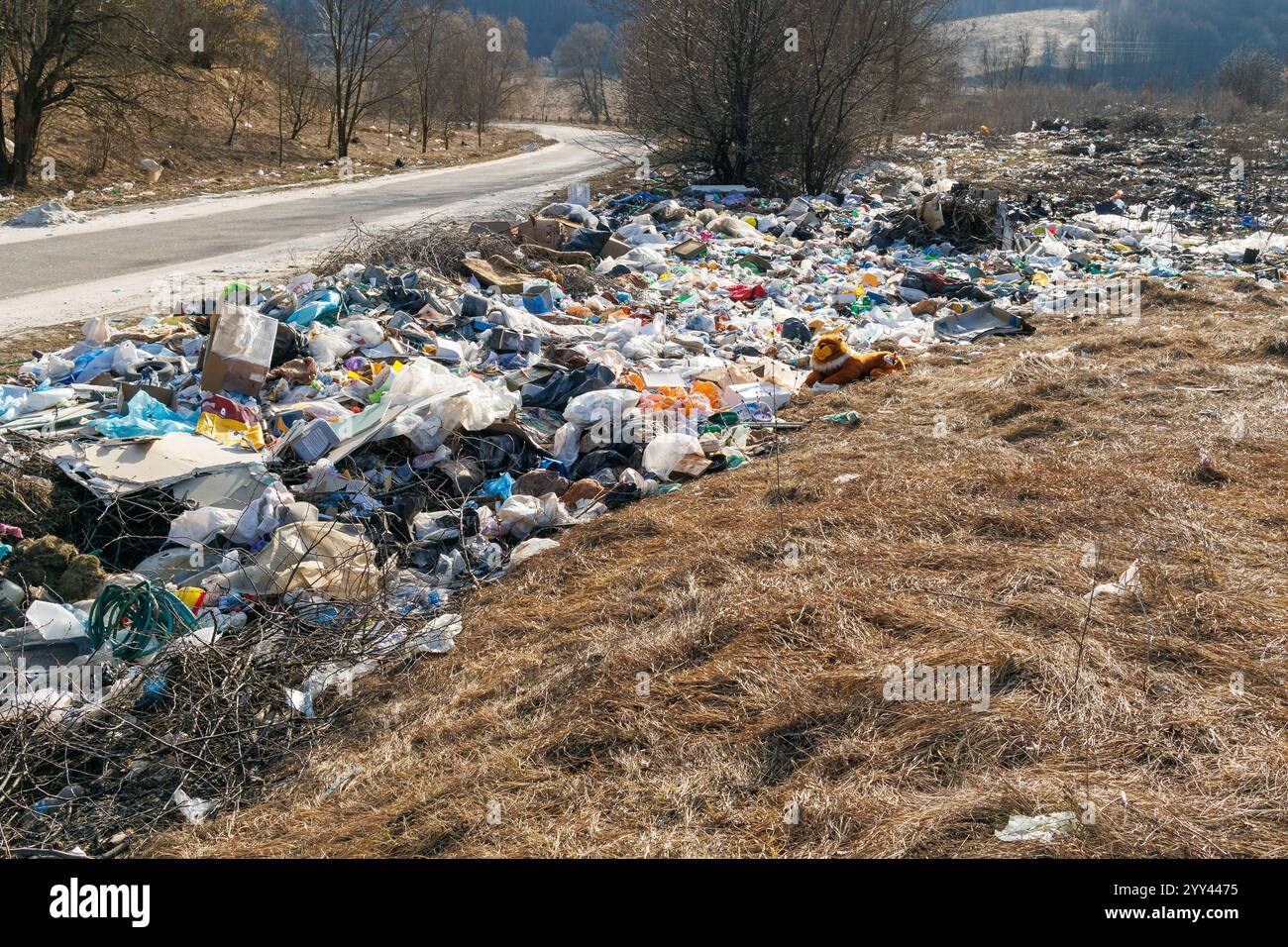 A dump of garbage left on the side of the road to understand the ...