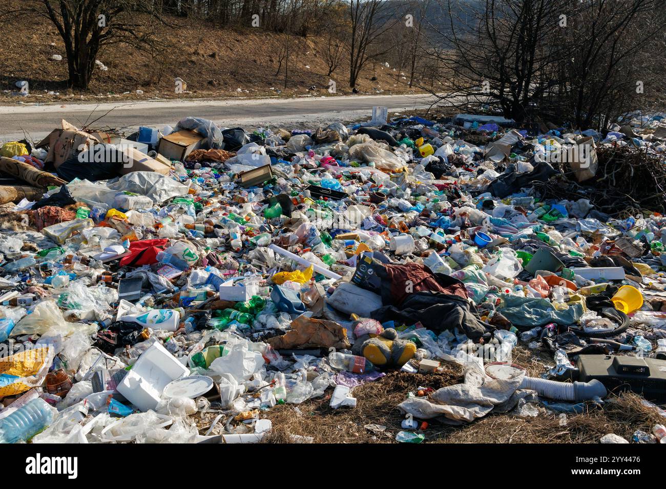 A dump of garbage left on the side of the road to understand the ...