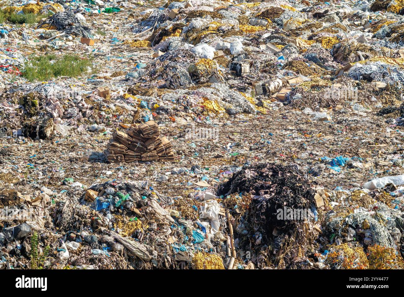 A view of a city dump or landfill. A pile of plastic garbage, food ...