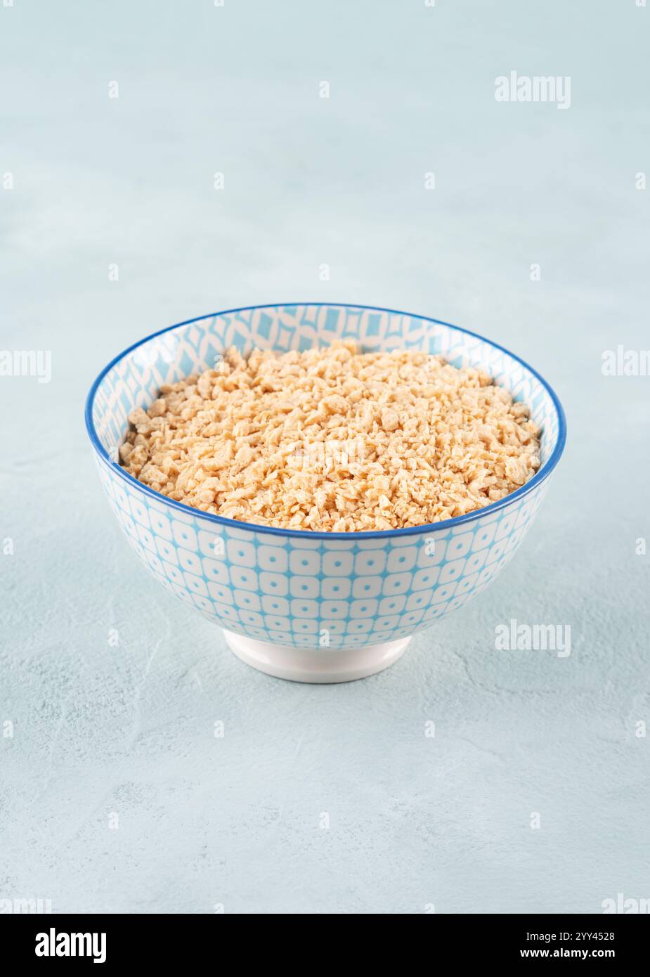 Vegan soy granules in bowl on turquoise background. Meat substitute ...