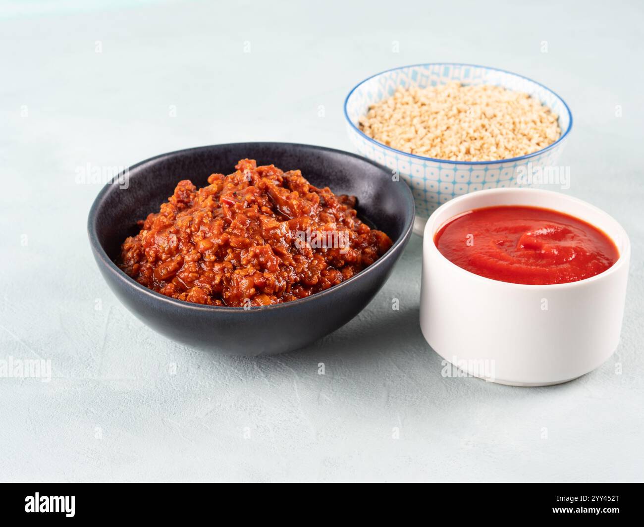 Vegan tomato bolognese ragu with soya protein granules in bowl Stock ...