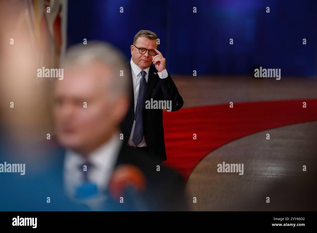 Finland's Prime Minister Petteri Orpo, center, arrives for an EU summit at the European Council ...