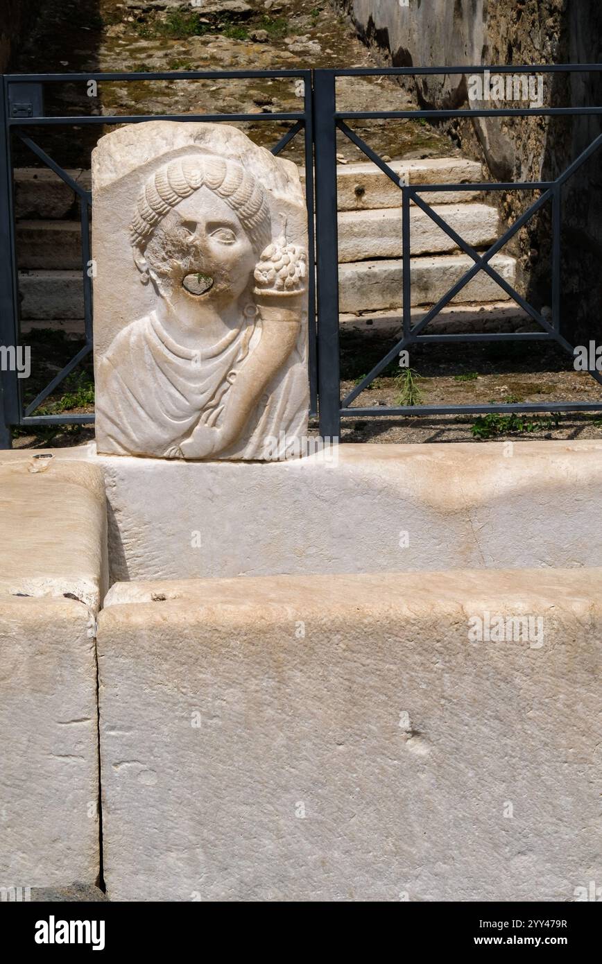 Ancient stone fountain. Pompeii was destroyed by the volcanic eruption ...