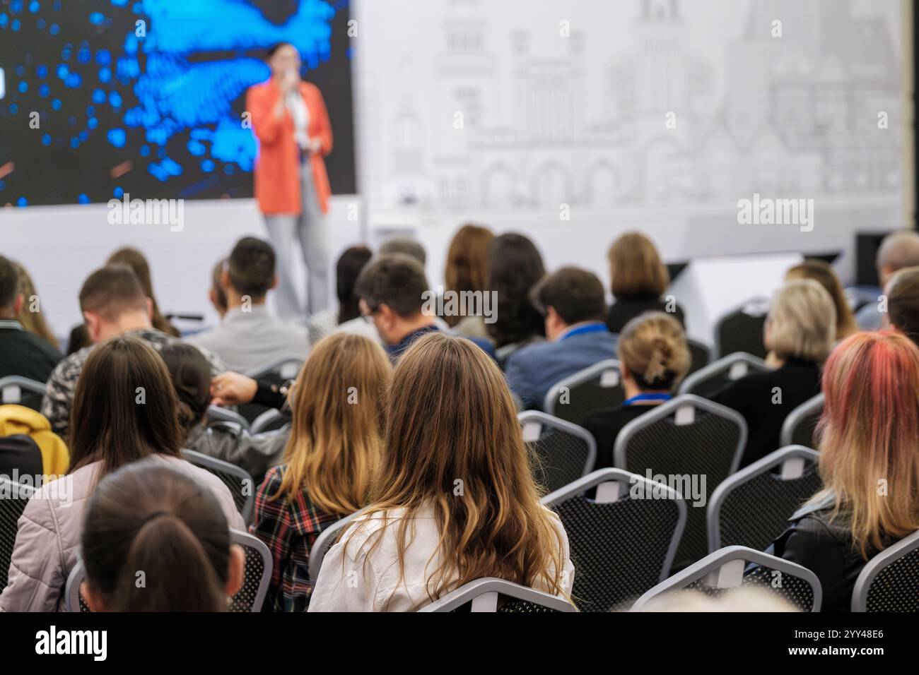 Diverse audience seated at a conference attending a speaker's ...