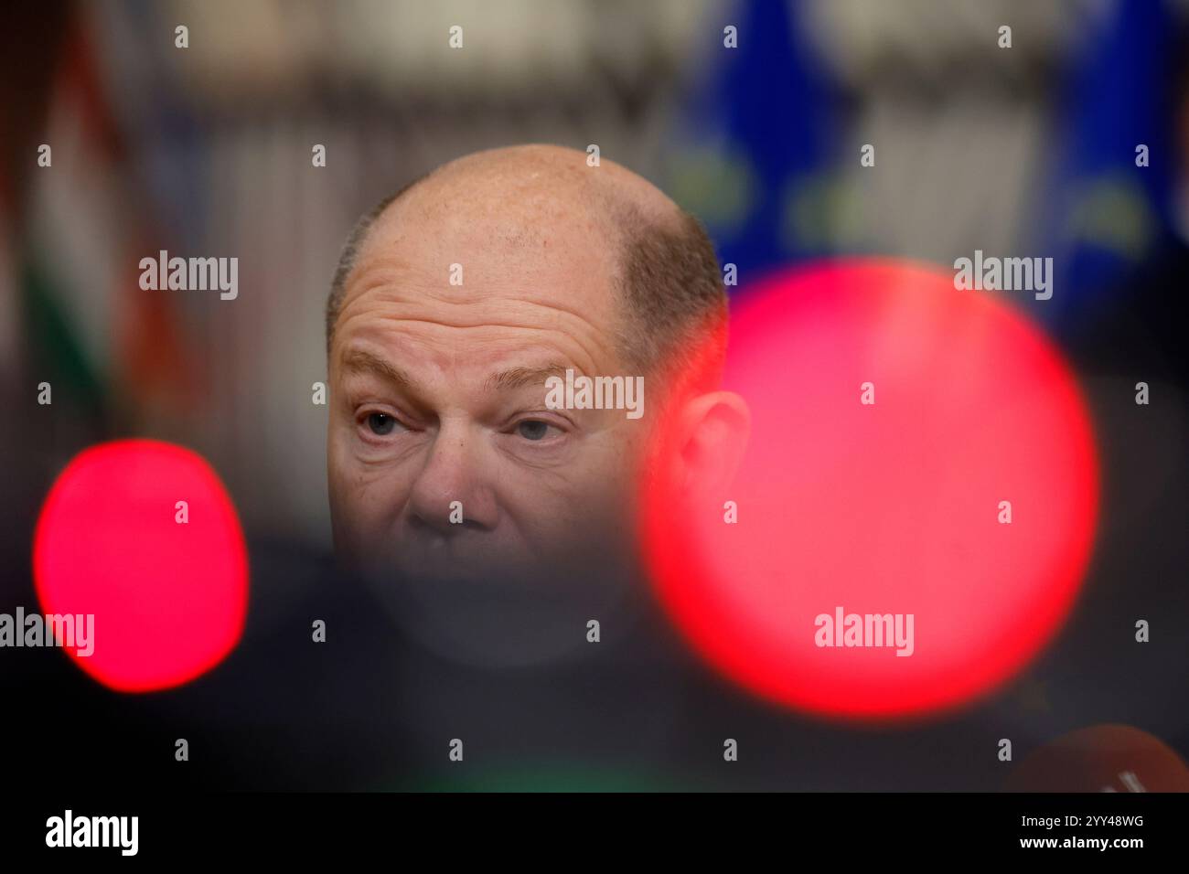 Germany's Chancellor Olaf Scholz speaks with the media as he arrives ...